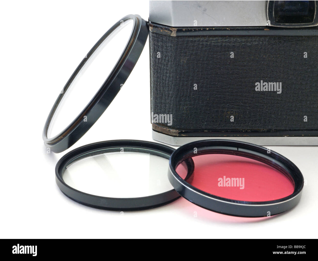 Three photography filters and camera Stock Photo - Alamy