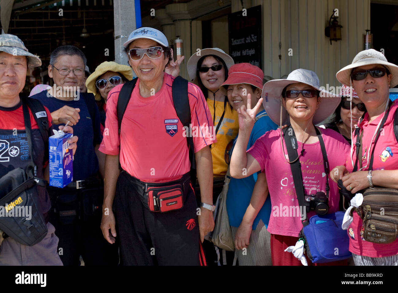 Group Japanese tourists. Smiling and happy group of Japanese tourists ...