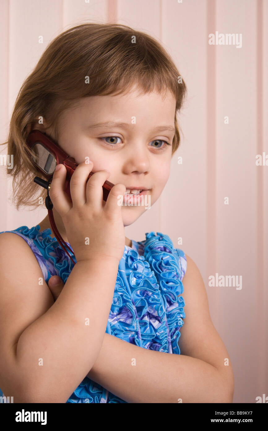 Pretty smiling girl talking at mobile phone Stock Photo - Alamy