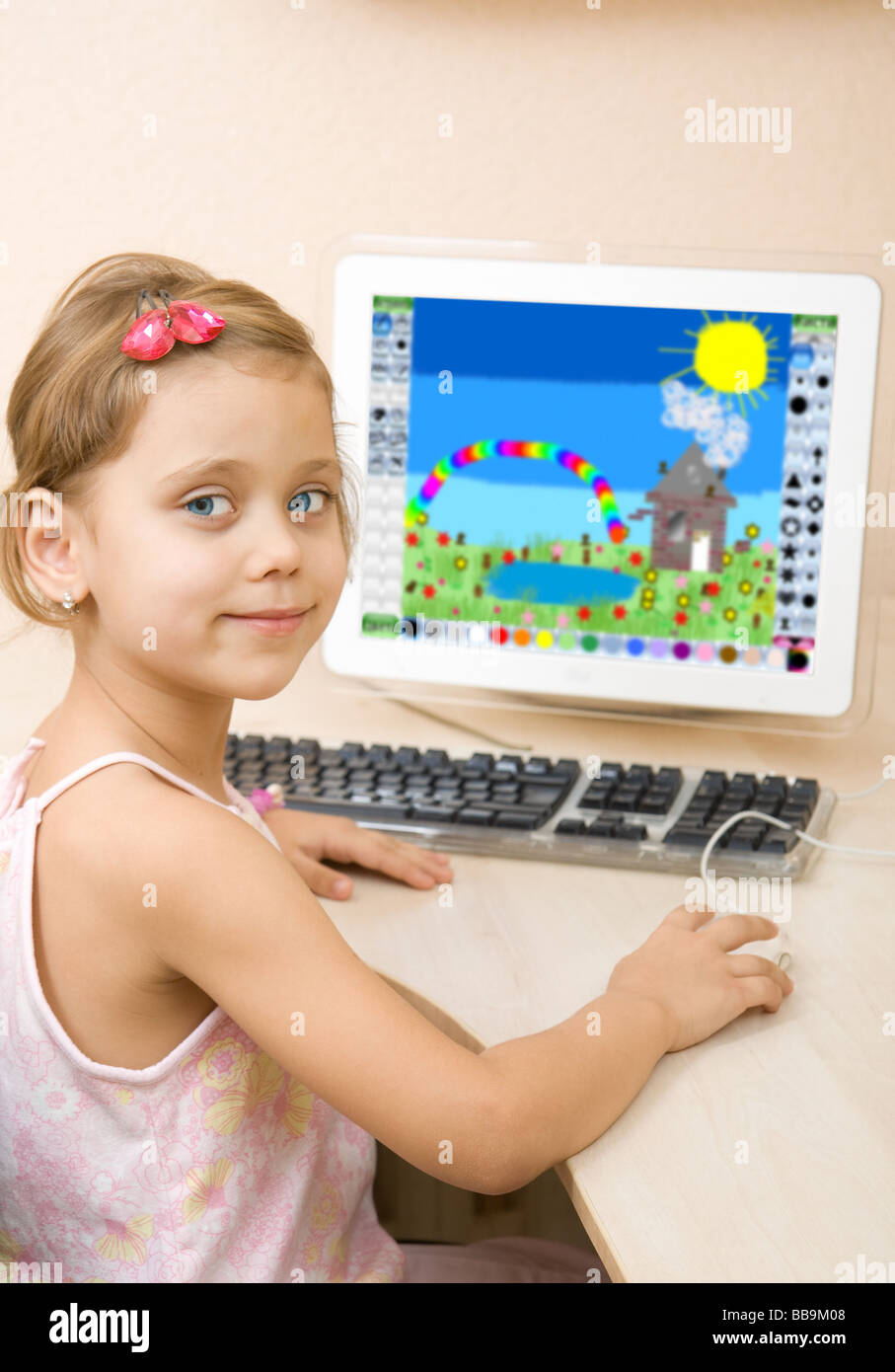 Little girl draws at the home computer Stock Photo - Alamy