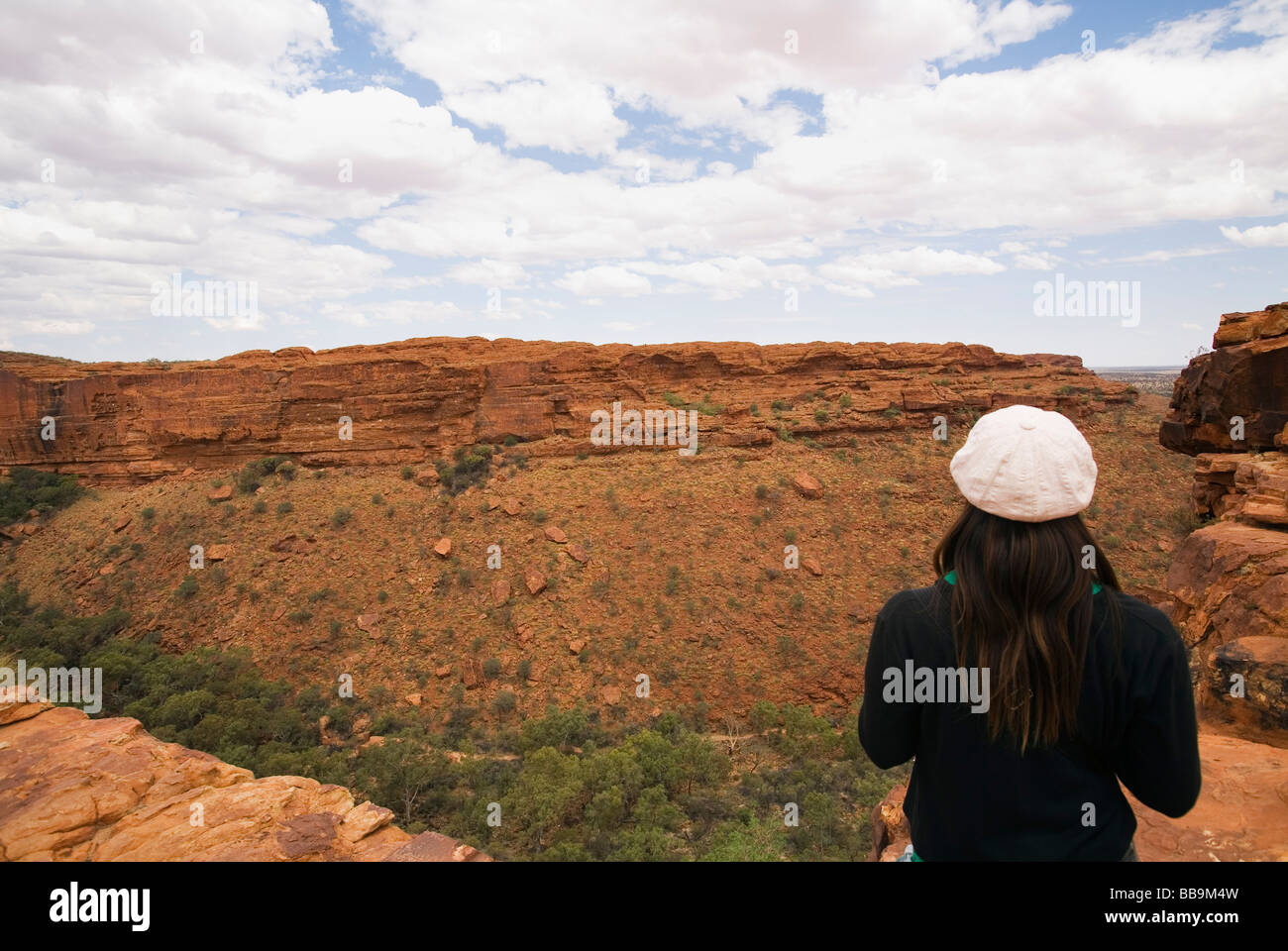 Tourist looking out over Kings Canyon. Watarrka (Kings Canyon) National ... Tourist looking out over Kings Canyon. Watarrka (Kings Canyon) National ...