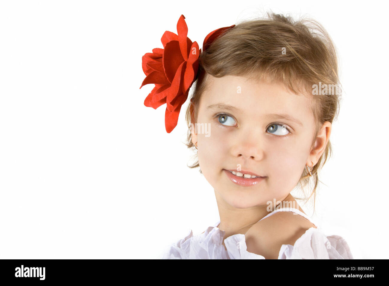 Little girl with red rouses in the hair Stock Photo - Alamy