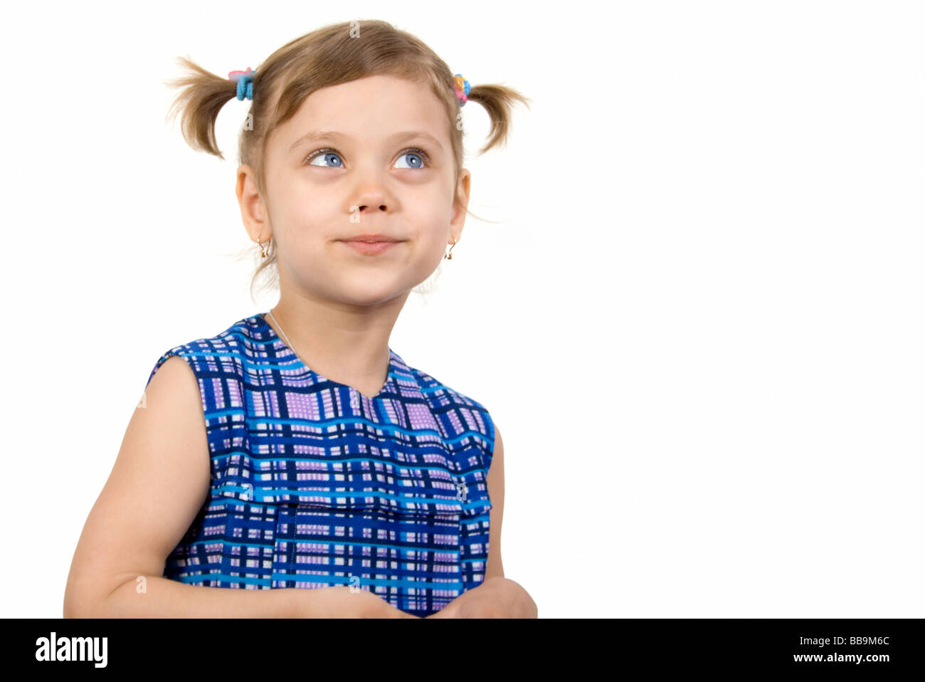 Pretty fun child look in up isolate on white Stock Photo - Alamy