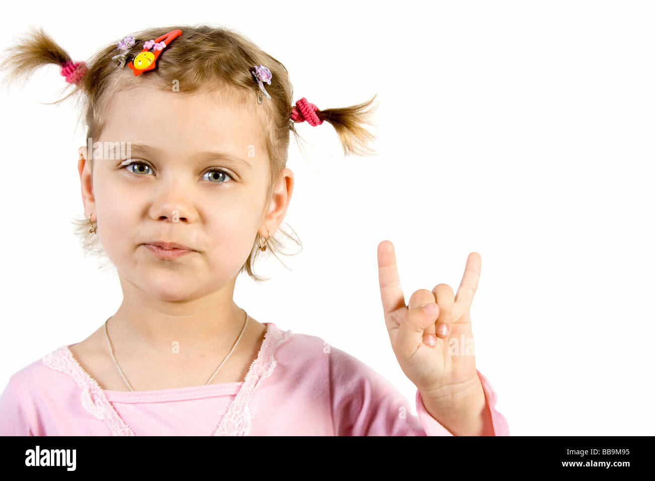 Little girl showing fingers sign Stock Photo - Alamy
