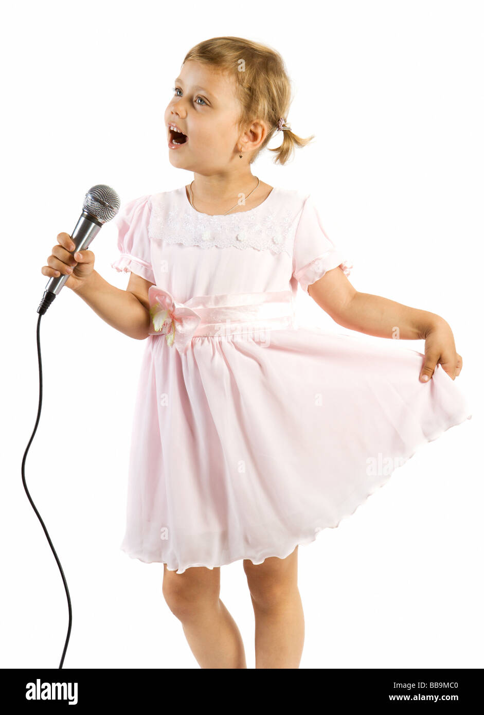 Little girl singing Isolated on white background Stock Photo - Alamy