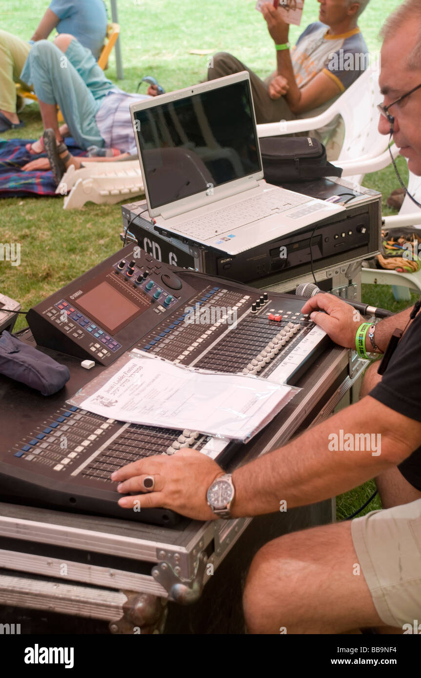 Sound technician at his station during a music performance Stock Photo ...