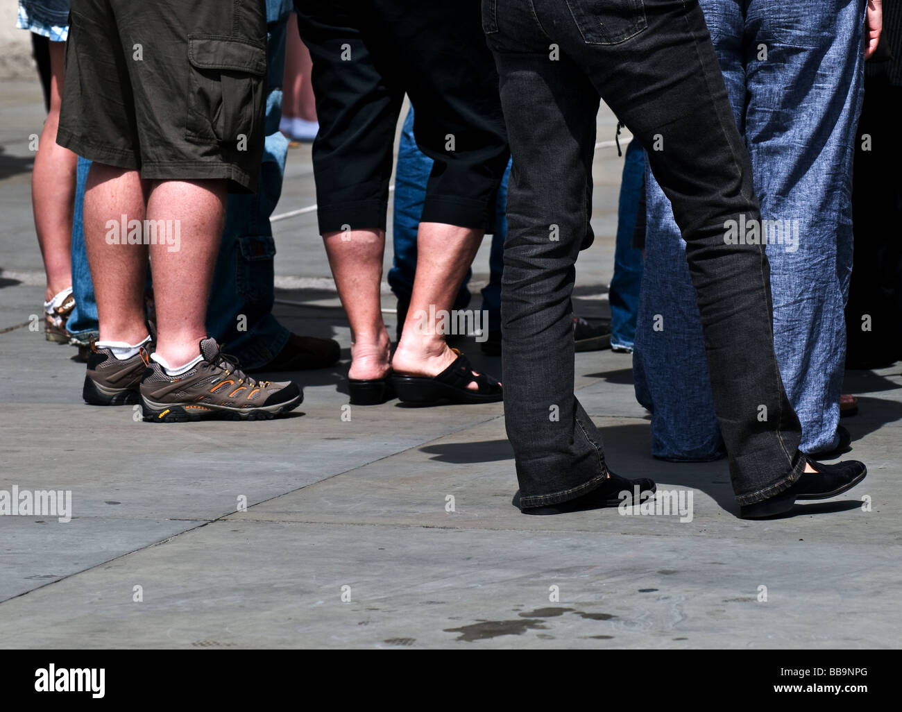 People standing in a queue. Photo by Gordon Scammell Stock Photo - Alamy