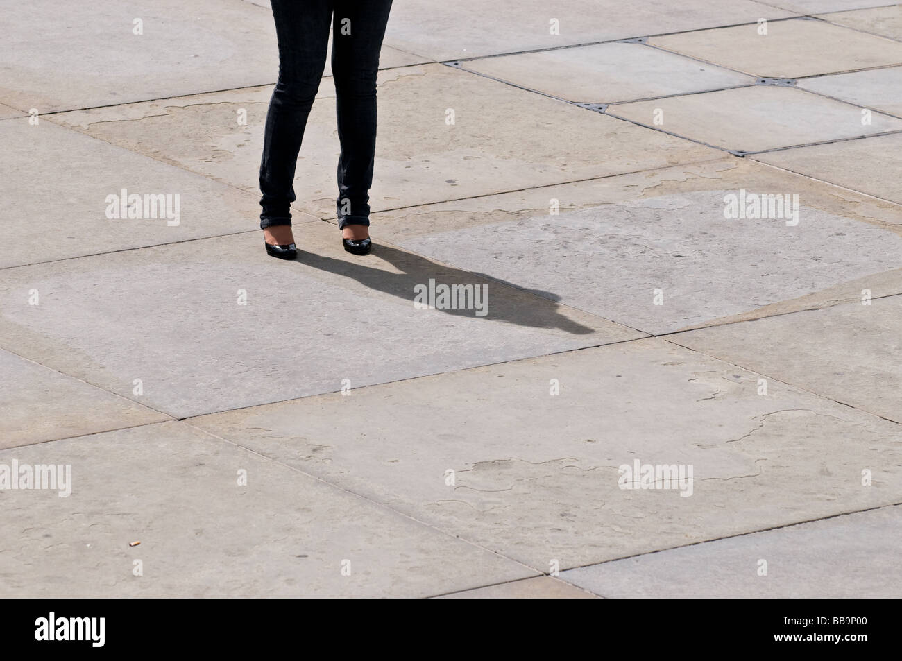 The legs of a woman casting a shadow. Photo by Gordon Scammell Stock ...