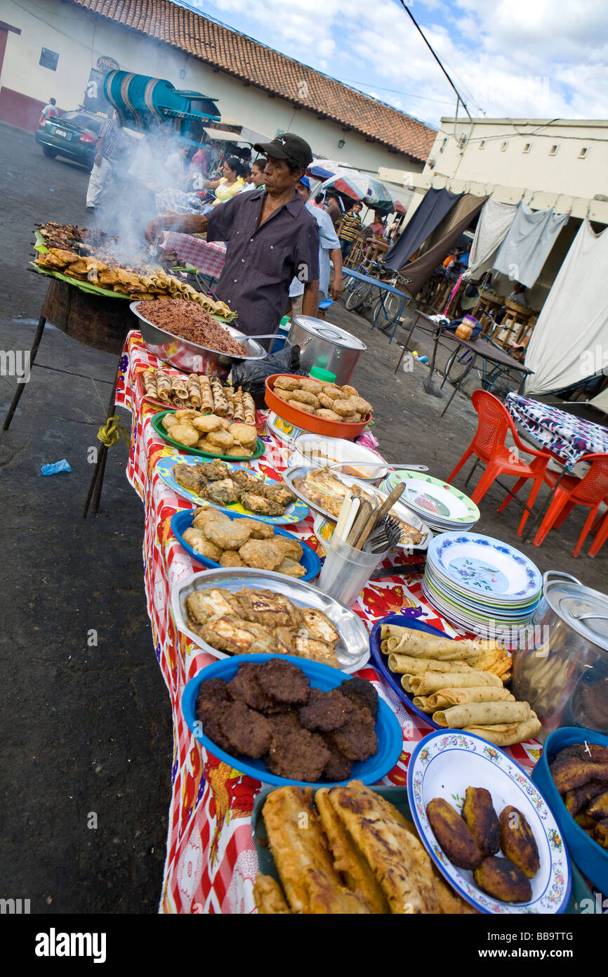 Nicaraguan Man Cooks Local Delicacies At Food Stand Behind La Catedral