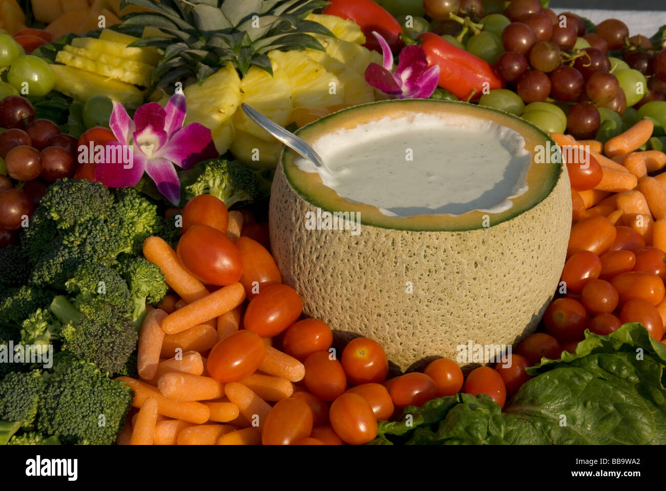 Vegetables and fruits served at a party with dressing Stock Photo - Alamy