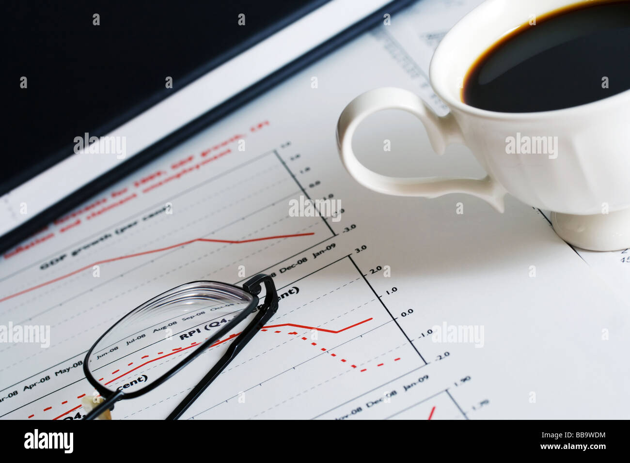 Cup of coffee and financial accounting Stock Photo - Alamy