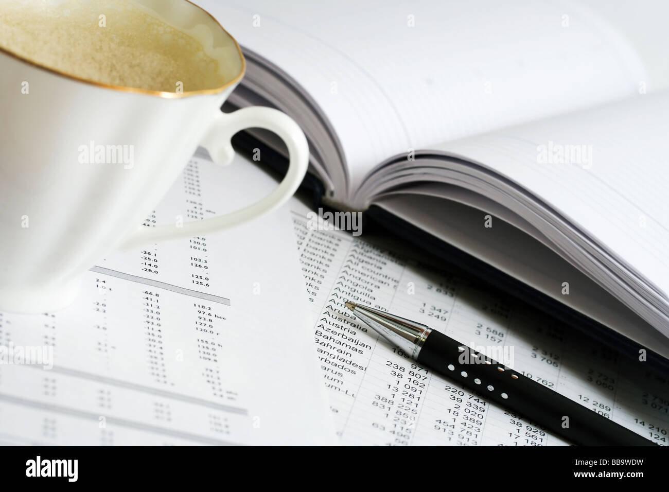 Cup of coffee and financial accounting Stock Photo - Alamy
