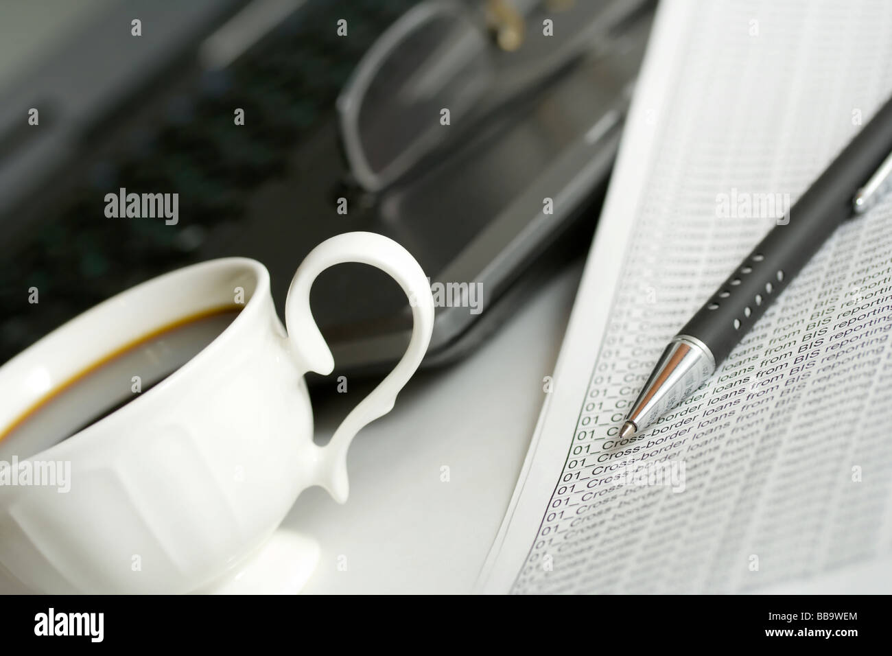 Cup of coffee and financial accounting Stock Photo - Alamy