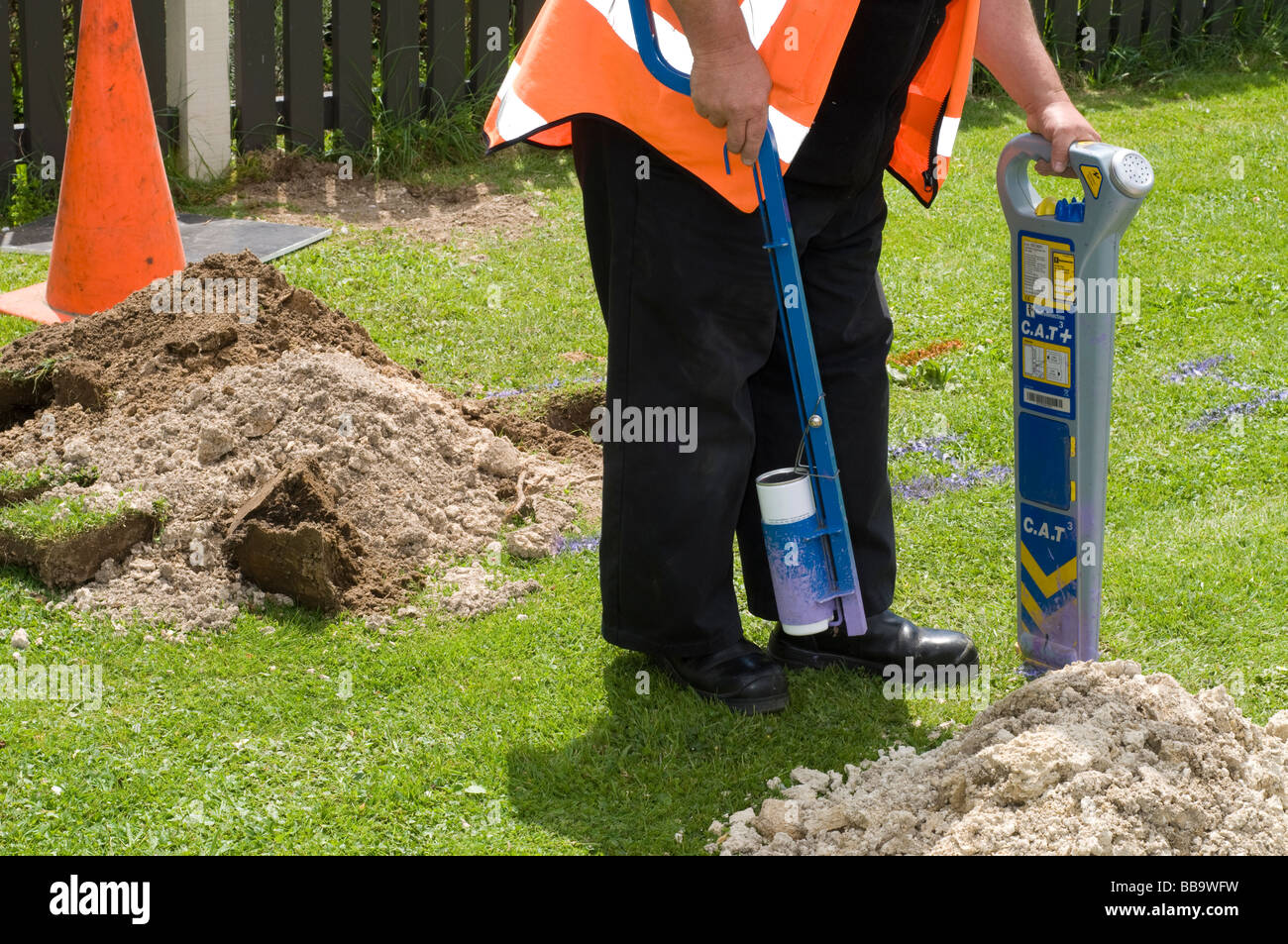 Telephone technician digging hole and connecting wiring Stock Photo - Alamy