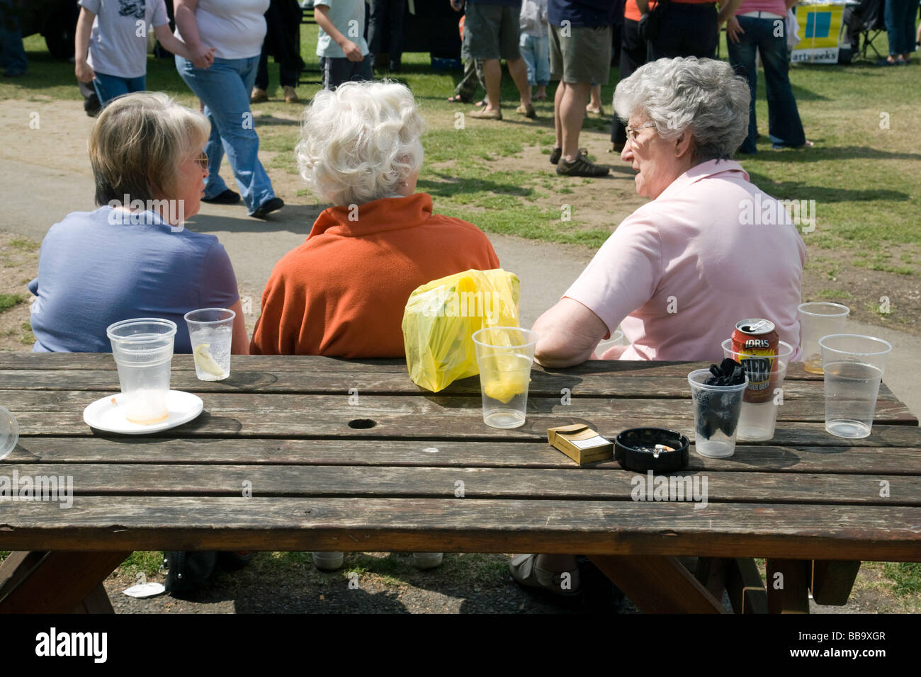 Three elderly ladies drinking outside a pub on a summers day, The Coach ...