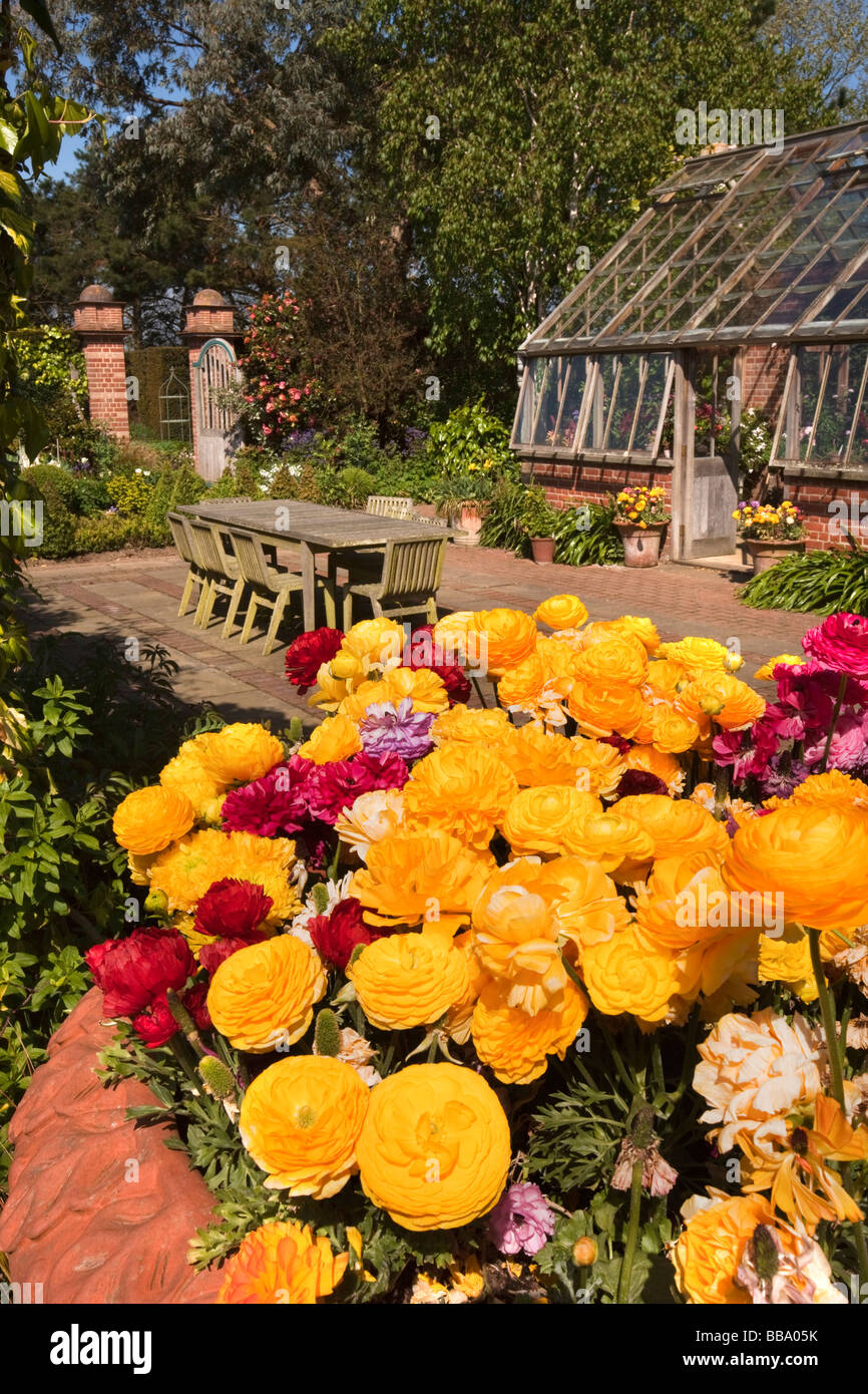 Norfolk East Ruston Old Vicarage Garden sheltered picnic table in sunny corner beside greenhouse ...