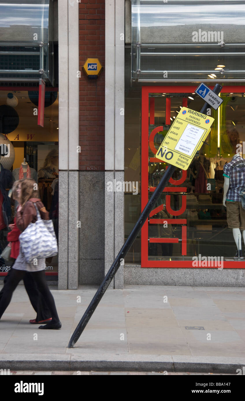 bent parking sign Stock Photo - Alamy