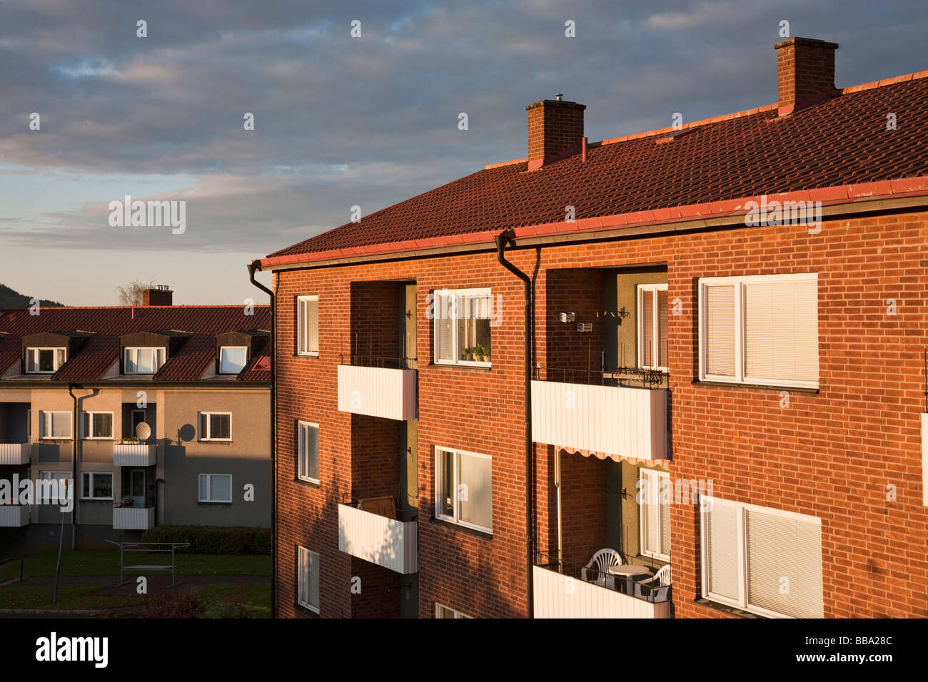 Apartment building with balconies in sunset Stock Photo - Alamy