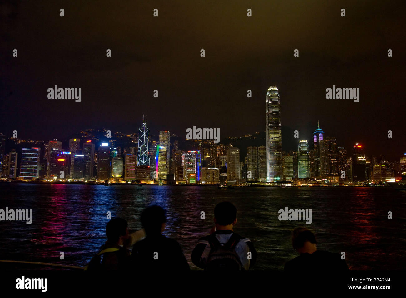 Skyline of Hong Kong Island at night, view from the waterfront promenade Kowloon, Hong Kong ...