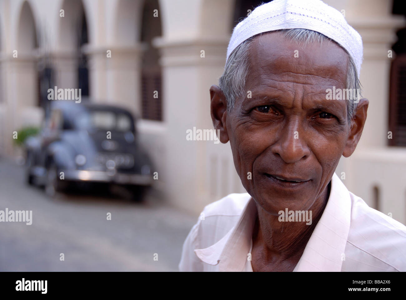 Islam, portrait, smiling Muslim with a white cap, black vintage Minor ...