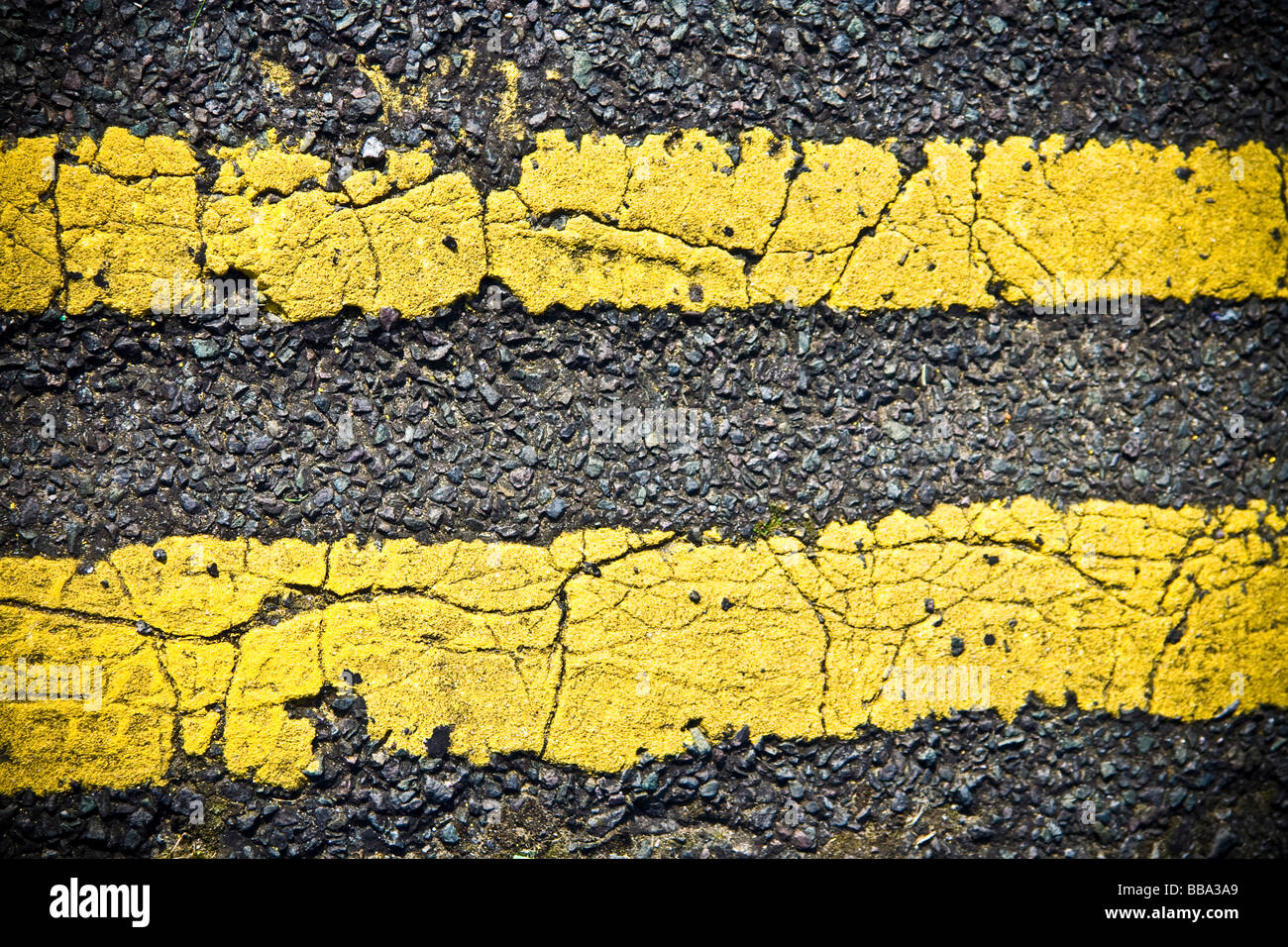 Abstract image of double yellow lines on the road Stock Photo - Alamy