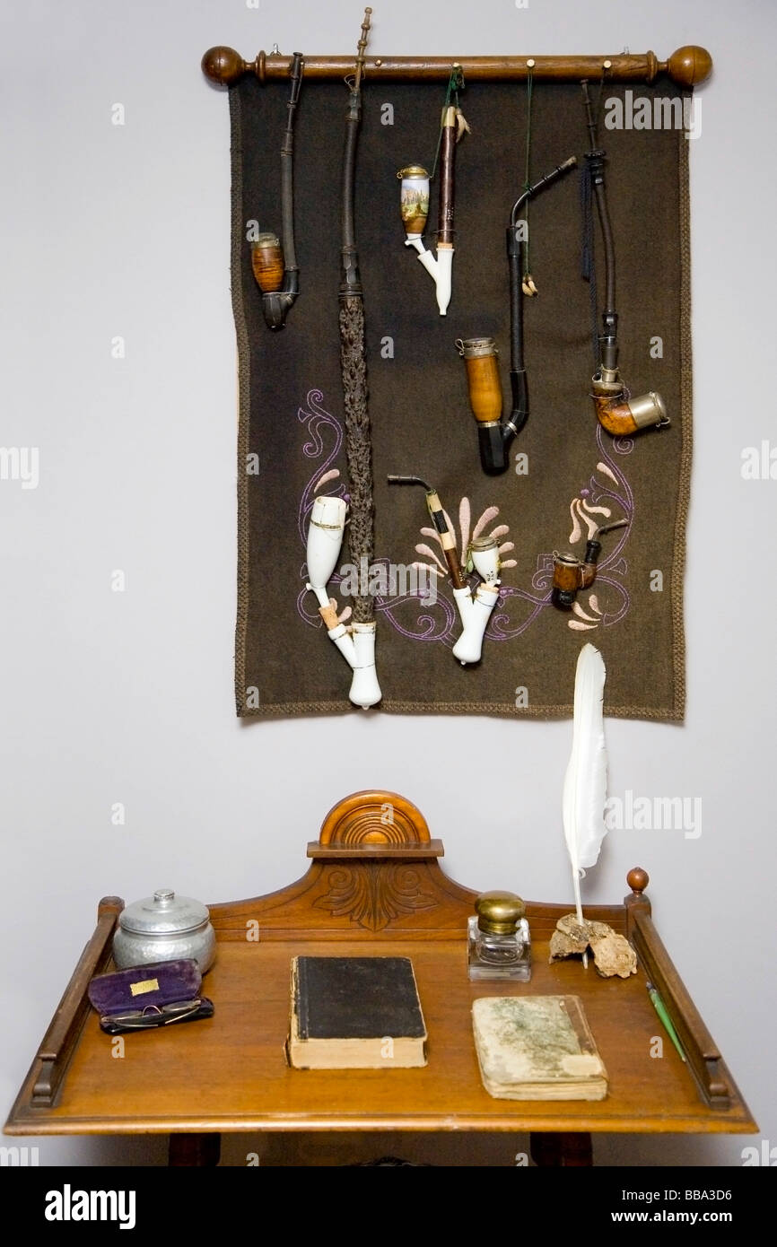 Historical writing desk and pipes Stock Photo - Alamy