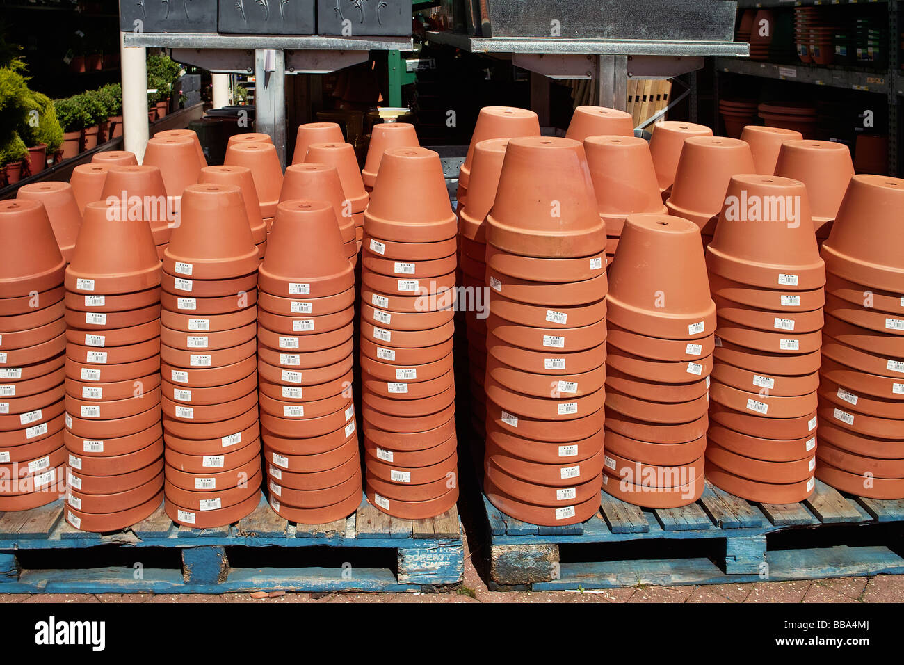 a pile of small new plant pots in a garden centre,uk Stock Photo - Alamy