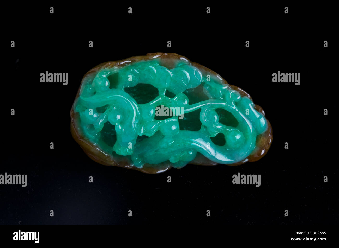 Jade Dragon Carving on black background Stock Photo - Alamy