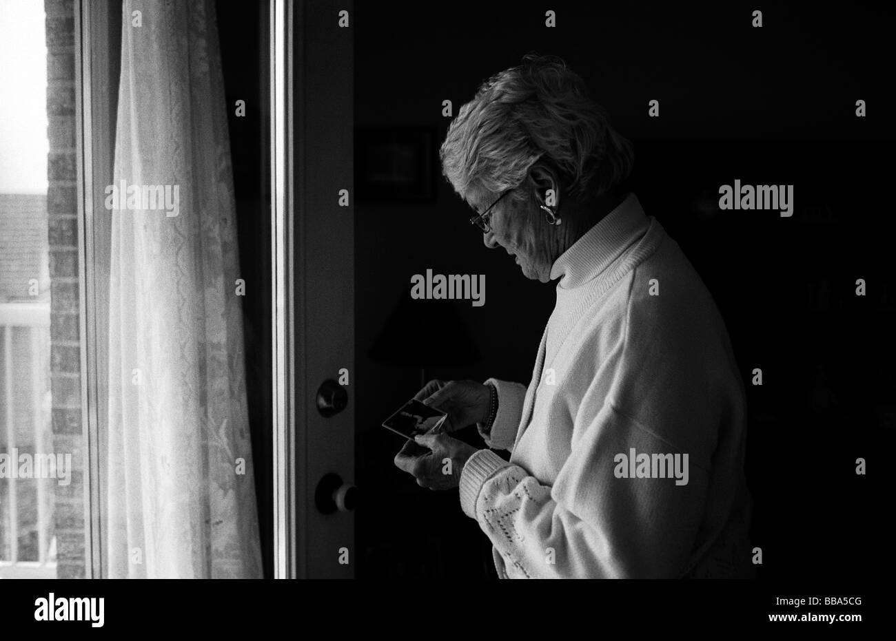 Old woman window dementia Black and White Stock Photos & Images - Alamy
