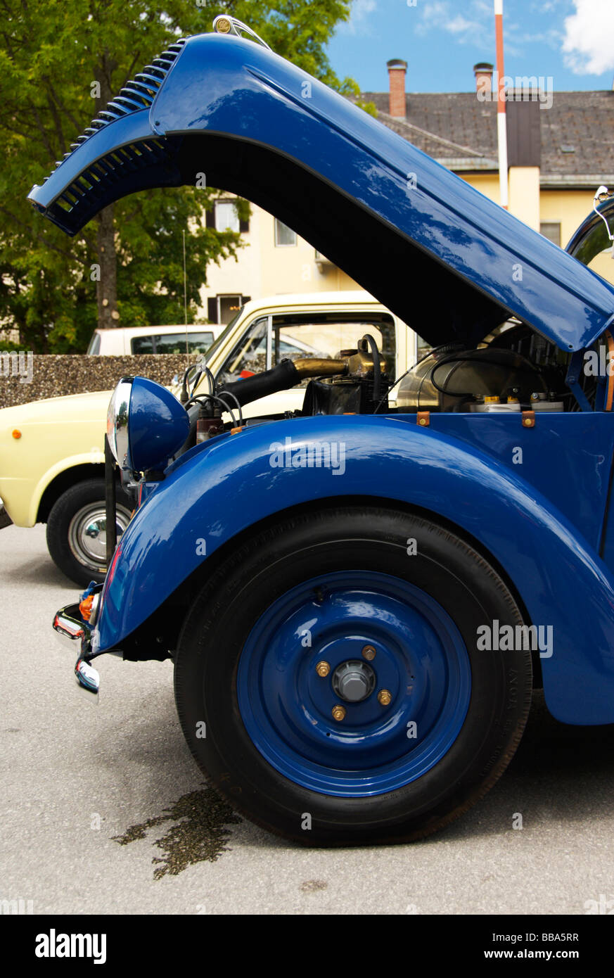 Open bonnet of a blue classic car Stock Photo - Alamy