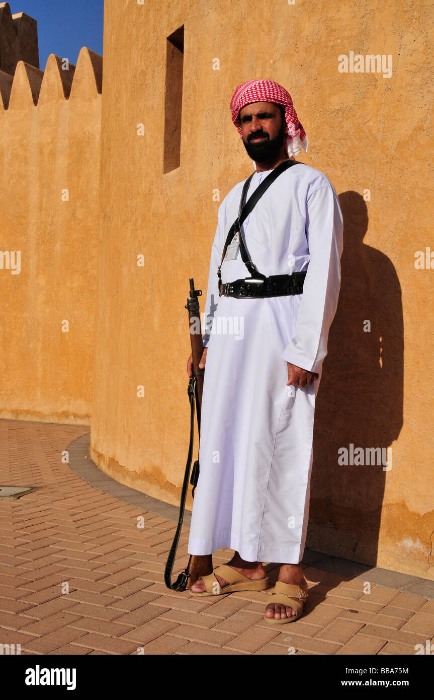 Guard with rifle in front of the tower of the Al Ain Palace Museum, Al ...