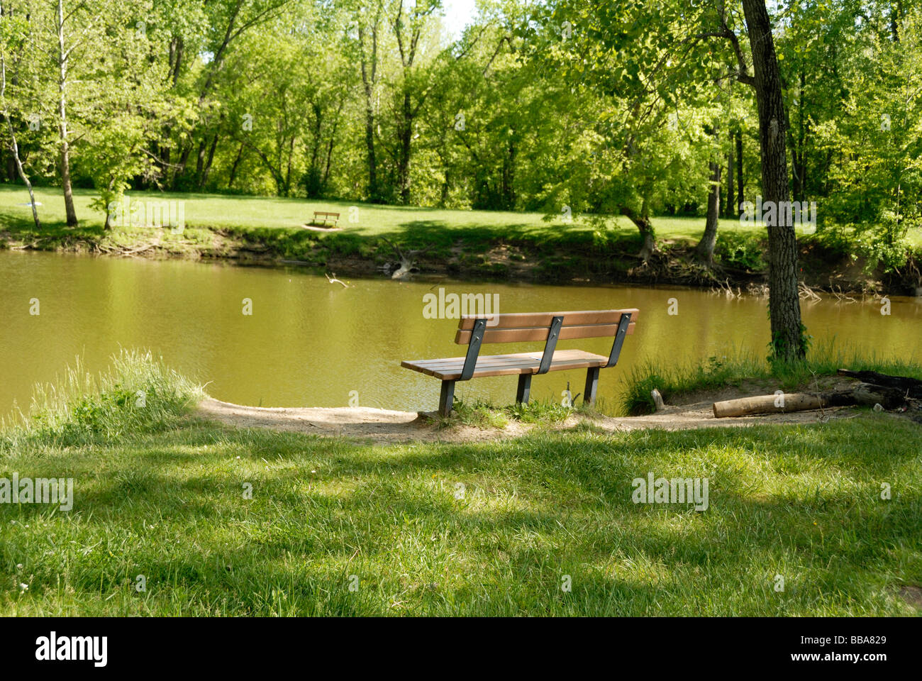 bench by fishing pond Stock Photo - Alamy