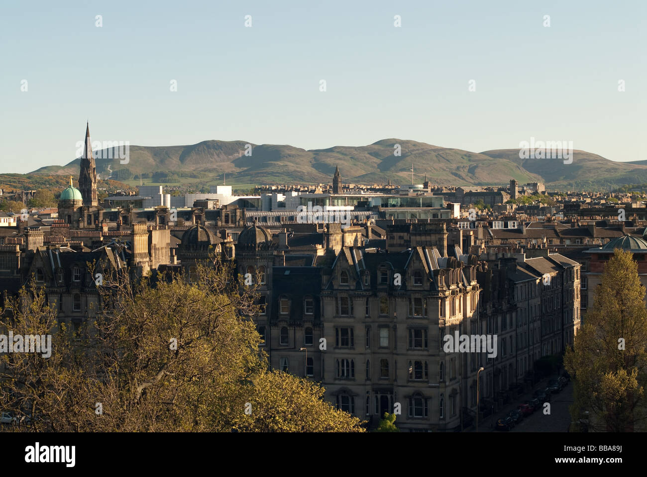 Southern Edinburgh and the Pentland Hills from Castle Rock with trees ...