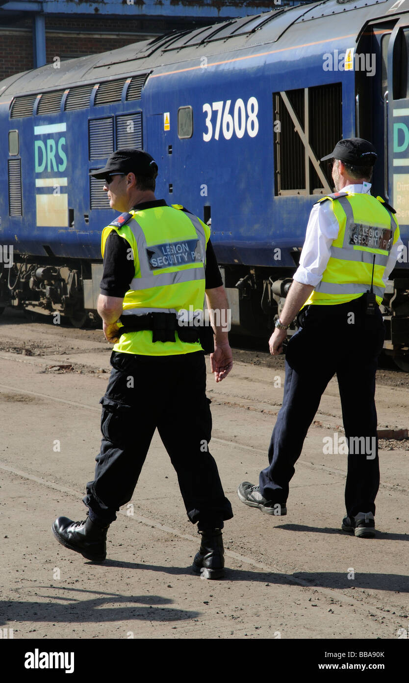 Manned security guarding security officers patrolling Stock Photo - Alamy