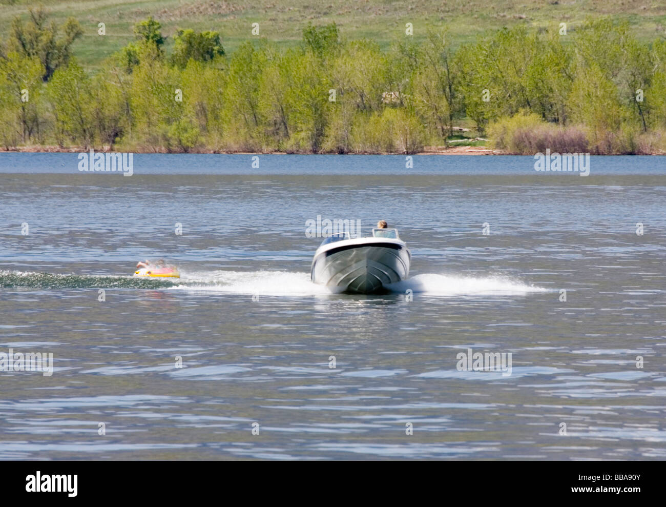 Young girl tubing Stock Photo - Alamy