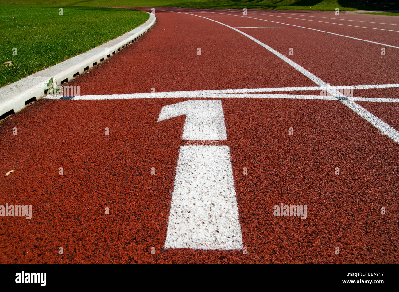 Running track number 1 in a stadium Stock Photo - Alamy