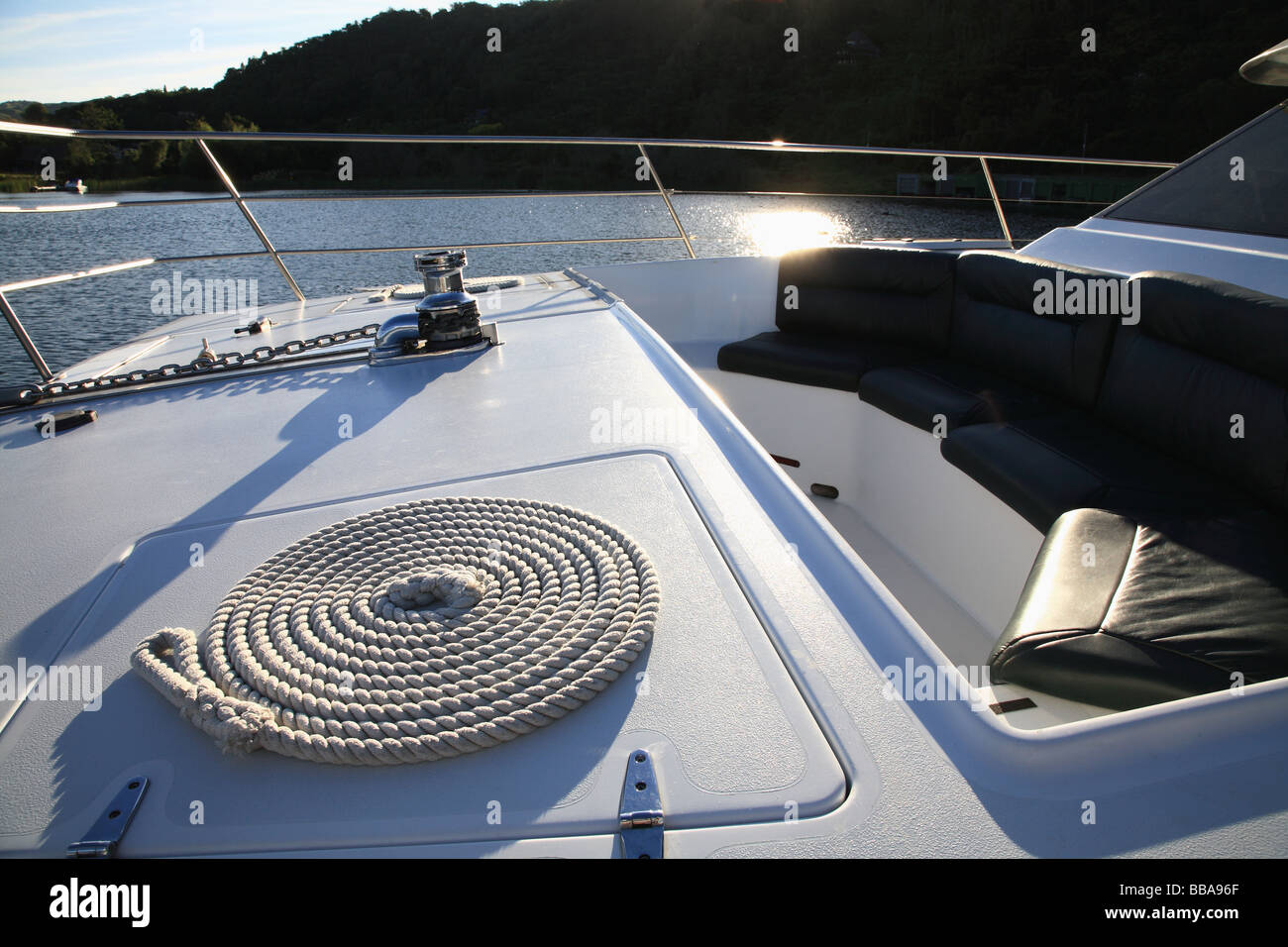 Coiled rope on deck of boat Stock Photo - Alamy