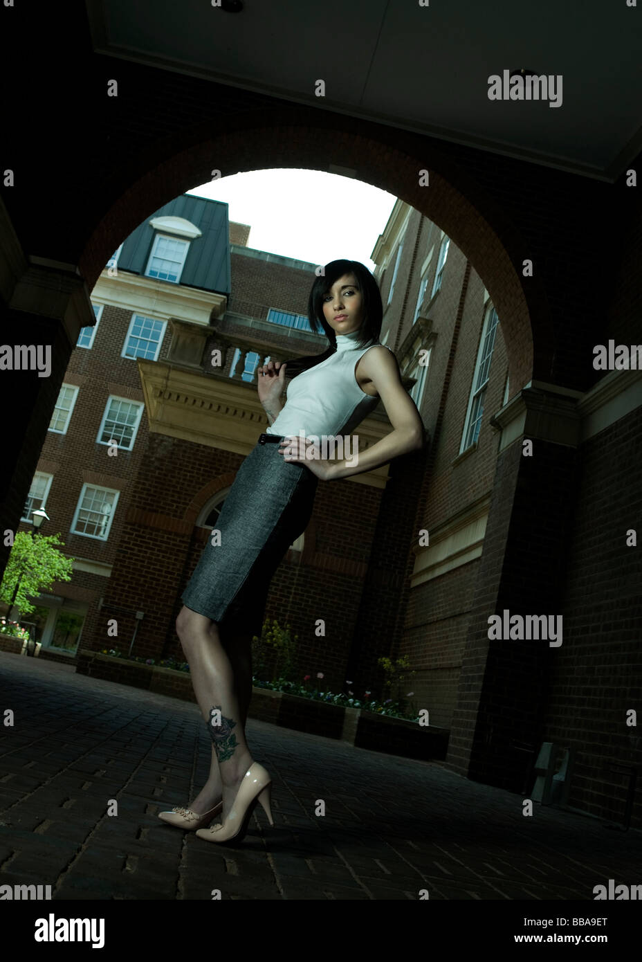 Young female under arch Stock Photo - Alamy