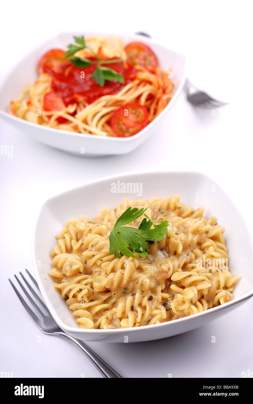 Two servings of delicious pasta Stock Photo - Alamy