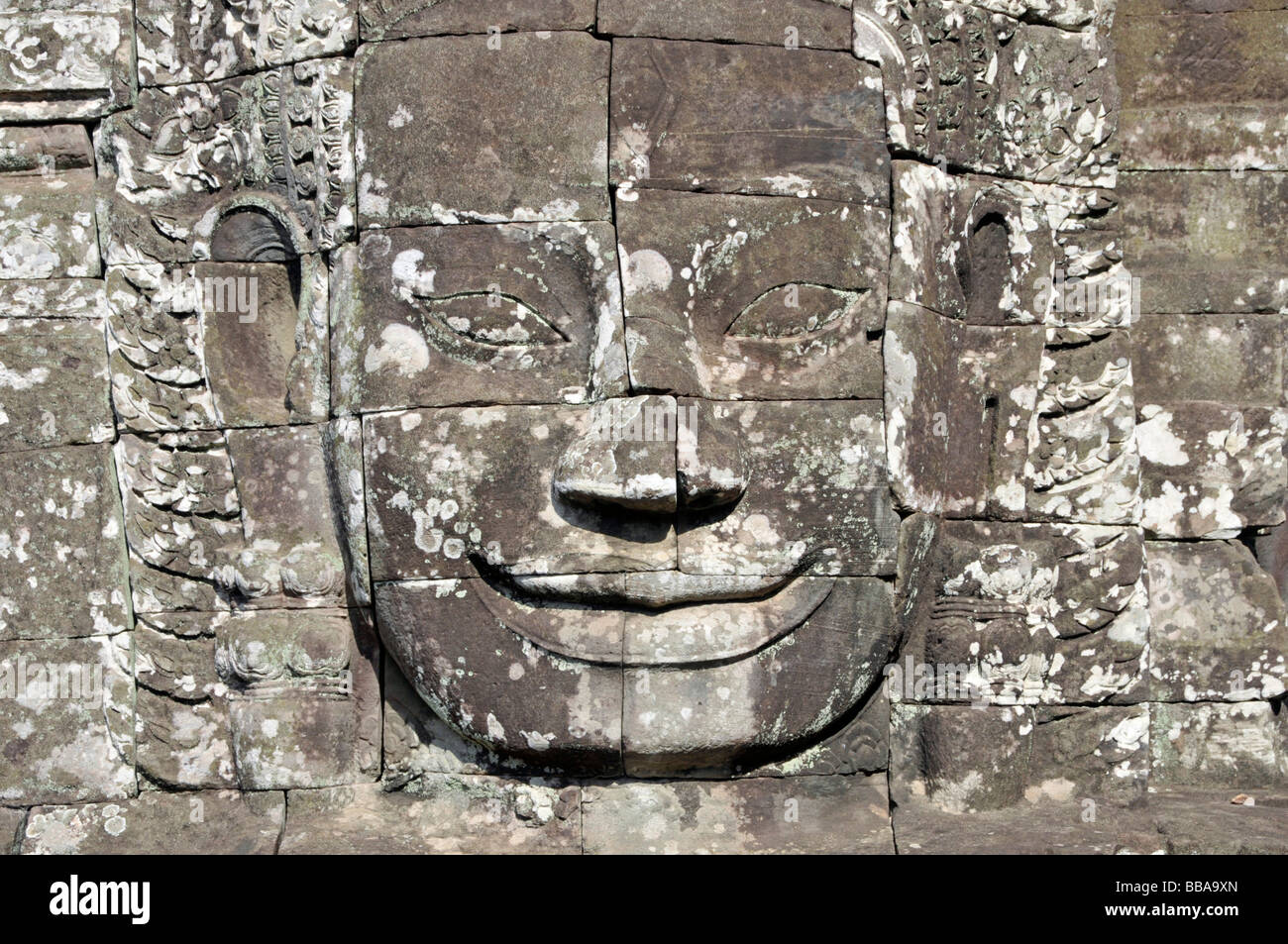 Huge face of the Bodhisattva Lokeshvara chiselled in stone, also called ...