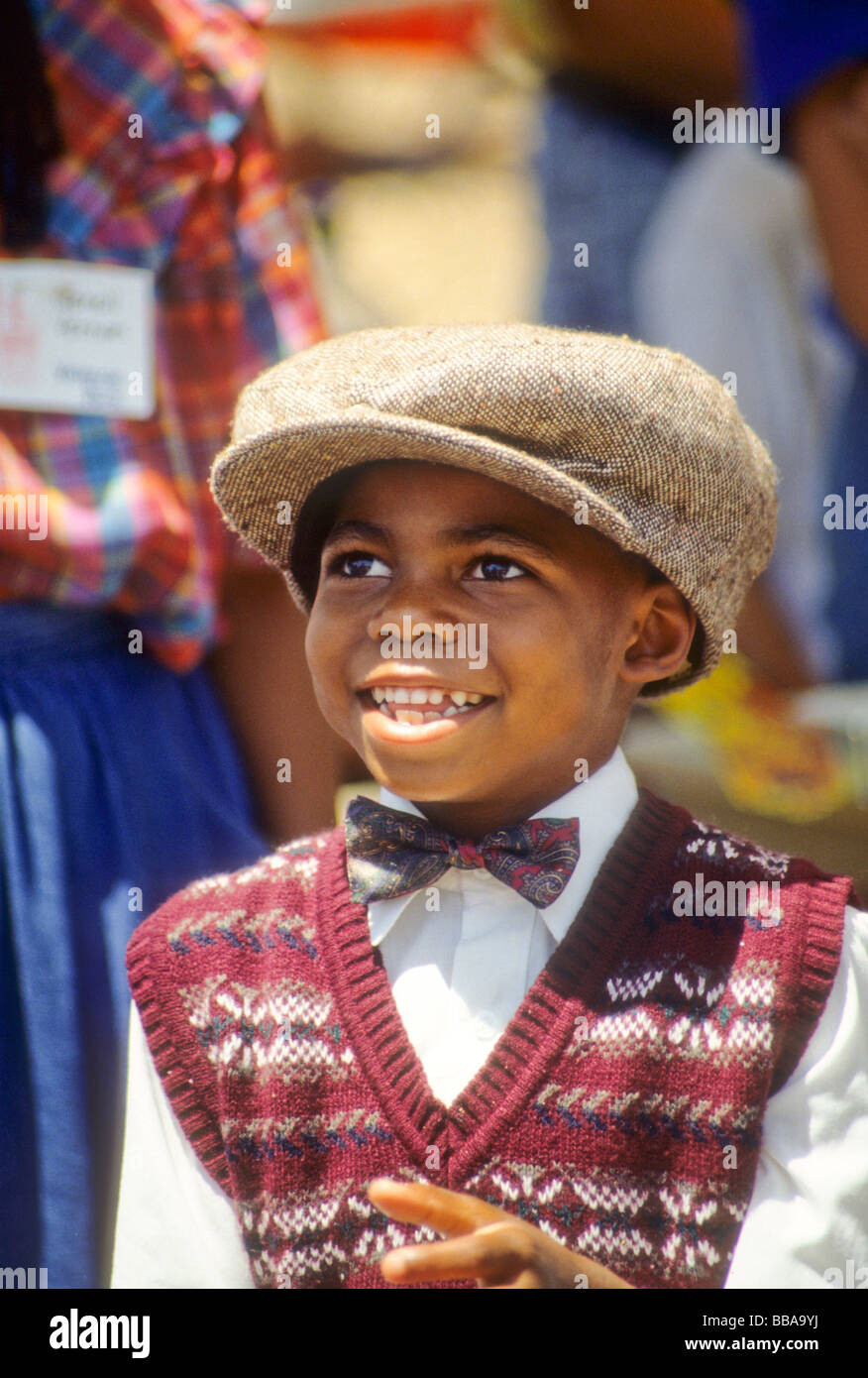 back boy hat smile cute face portrait bow tie happy Stock Photo - Alamy