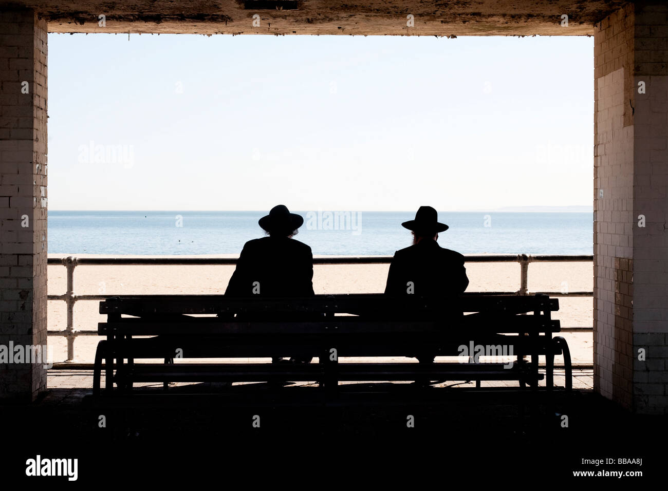 Two men overlooking the ocean Stock Photo - Alamy