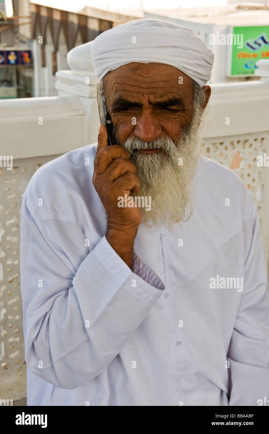 Omani man speaking on his mobile phone Muscat Stock Photo - Alamy