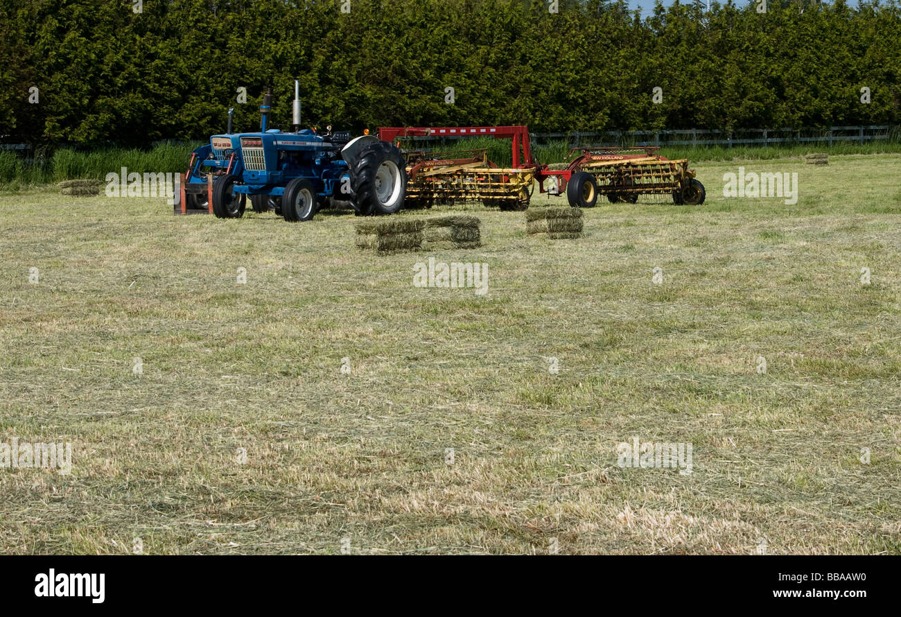 Tractor and hay bales Stock Photo - Alamy