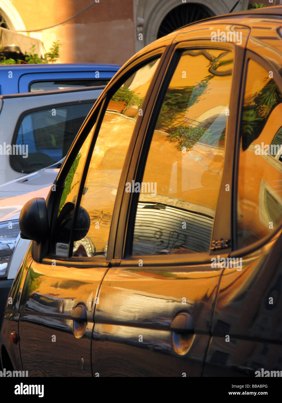 buildings reflected in renault scenic car window in trastevere, rome ...