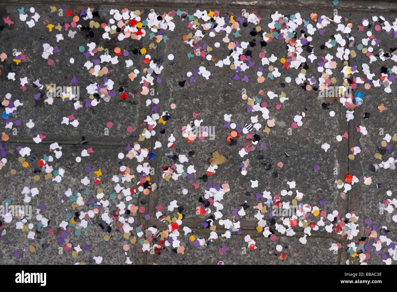 Confetti left on the pavement after a wedding in Paris Stock Photo - Alamy