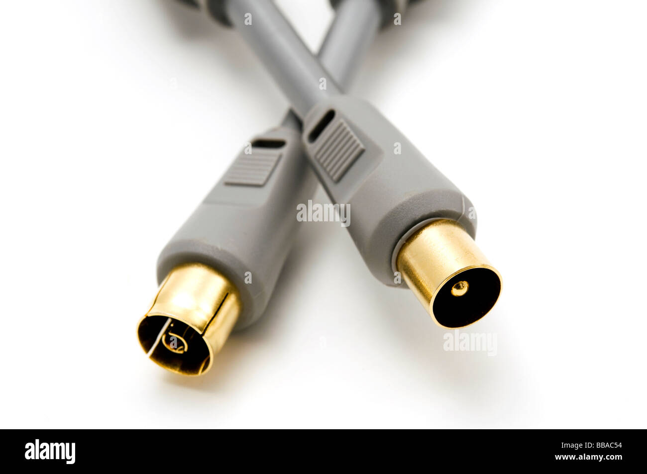 Gold plated cables on a white background Stock Photo - Alamy