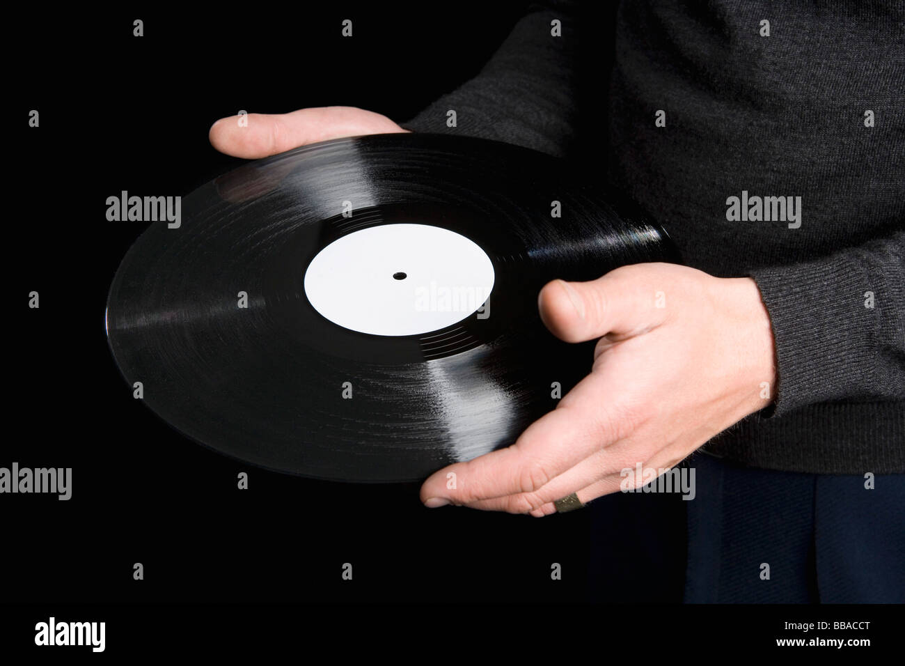 A man holding a record Stock Photo - Alamy