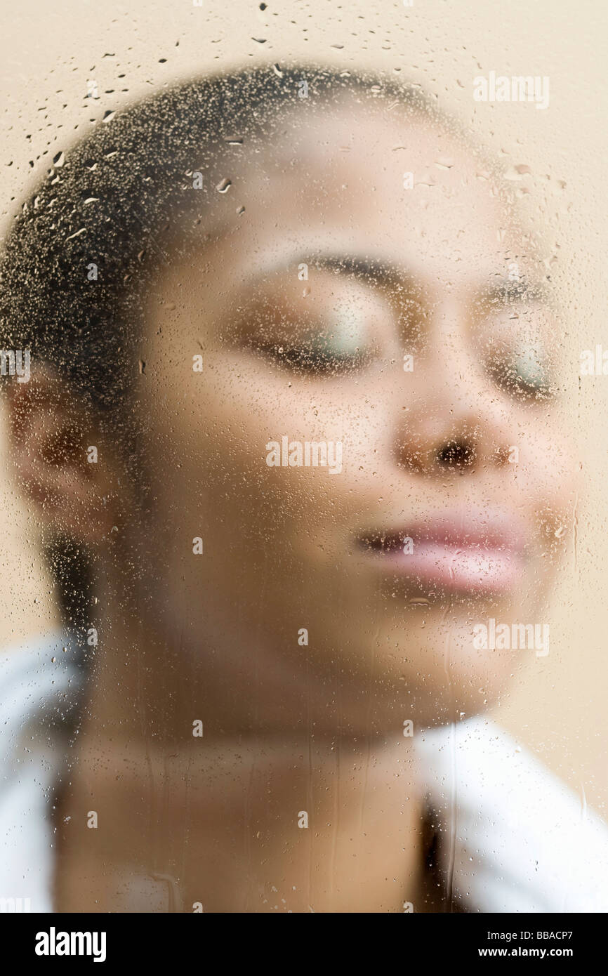 A young woman behind steamed glass Stock Photo - Alamy