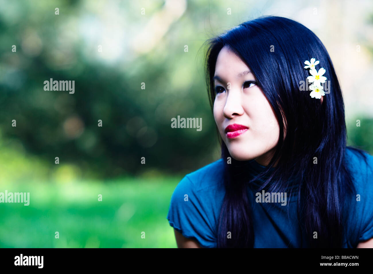 Young Asian girl in a park Stock Photo - Alamy